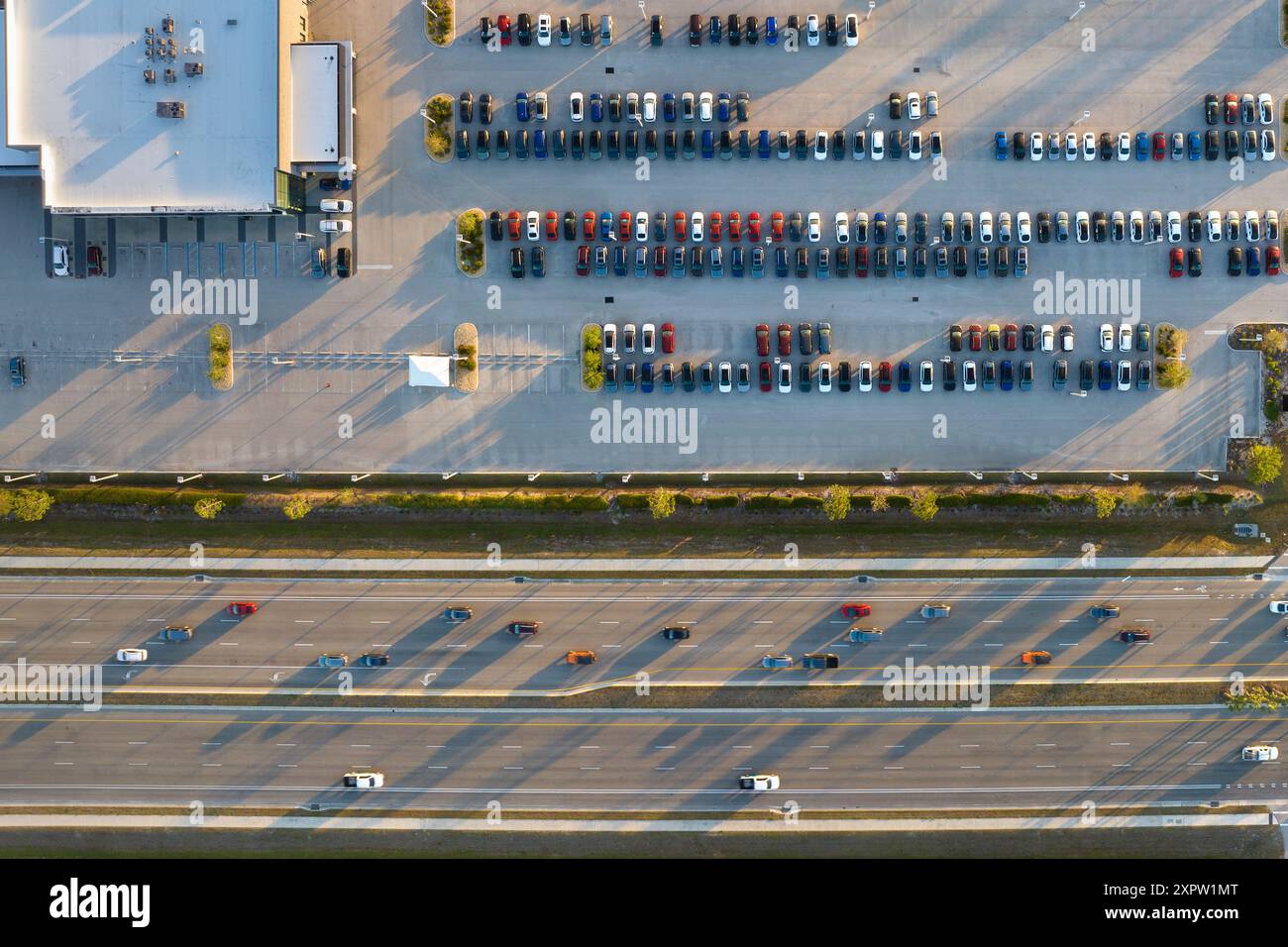 Large parking lot of local dealer with many brand new cars parked for ...