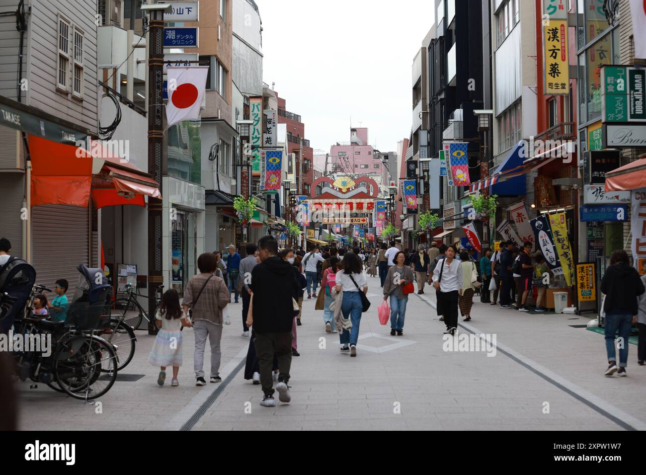 Sugamo archway is on the street. Sugamo is a neighborhood in Toshima, Tokyo, Japan. an old ...