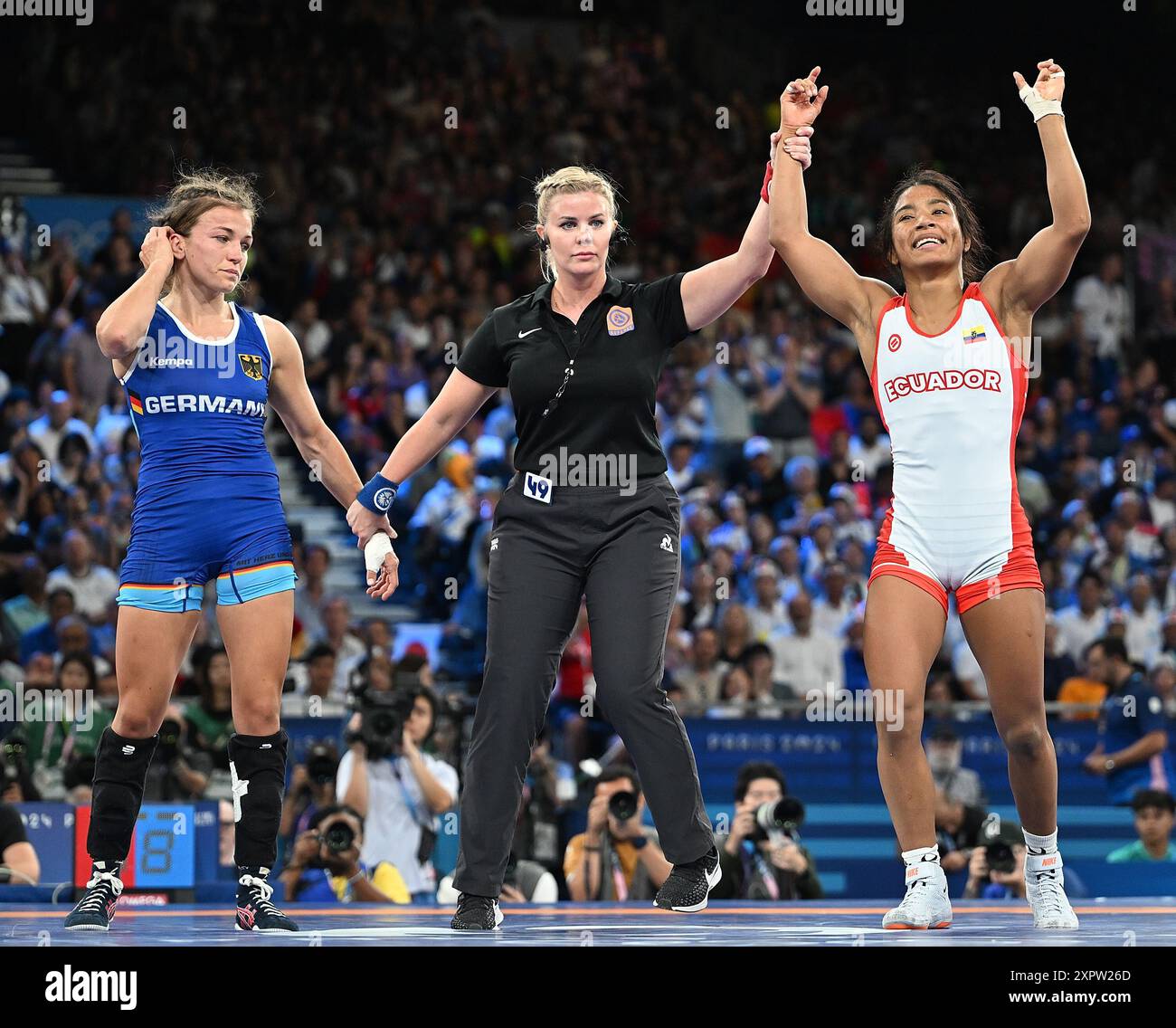 Paris, France. 7th Aug, 2024. Lucia Yamileth Yepez Guzman (R) of Ecuador has her hand raised ...