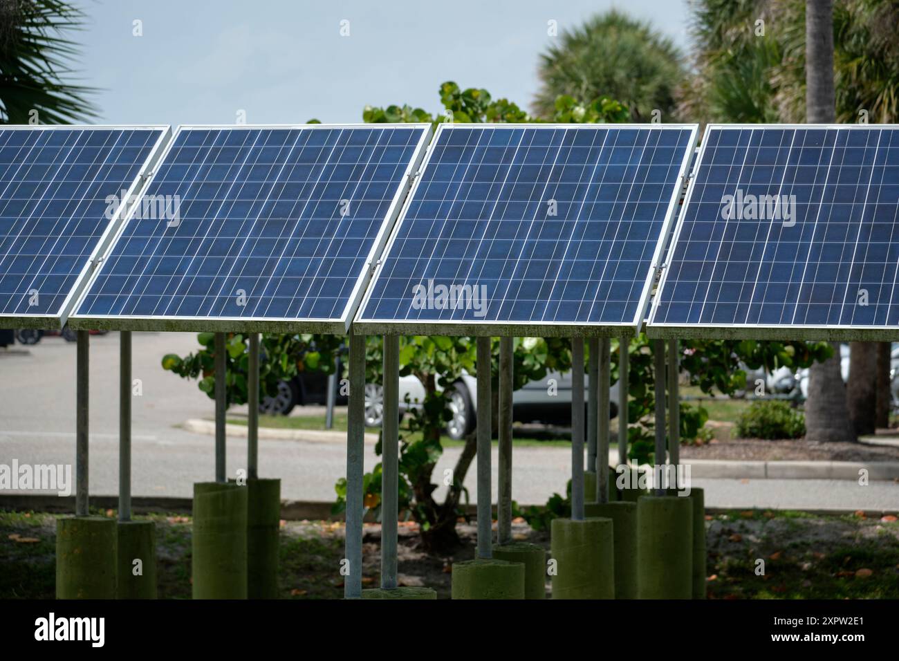 Solar panels installed on stand frame near parking lot for effective ...