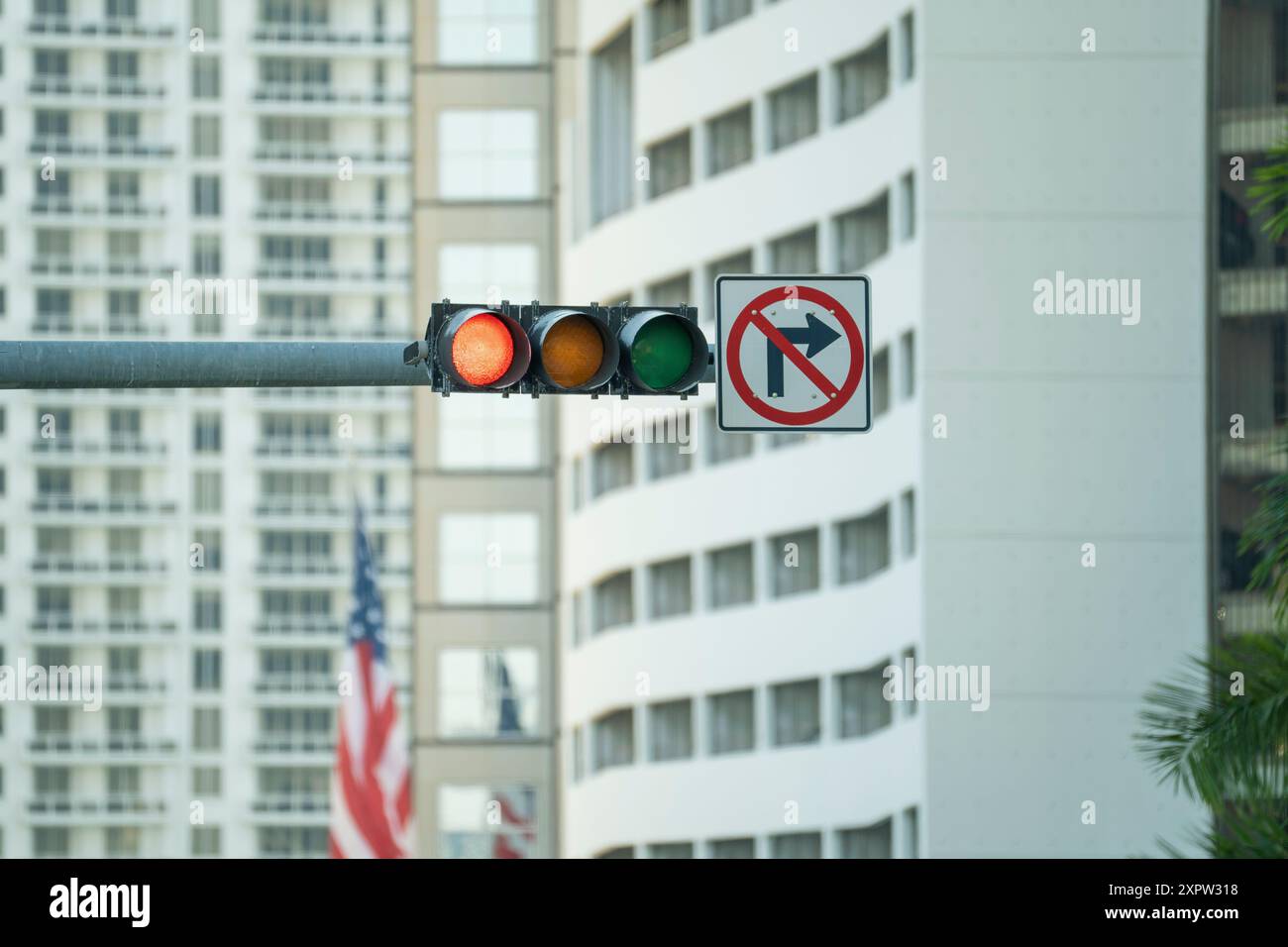 Traffic lights regulating driving cars on city street in Miami, Florida ...