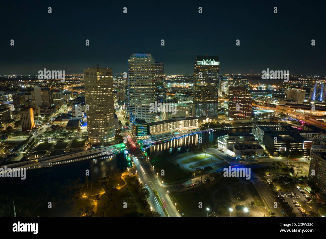 View from above of brightly illuminated high skyscraper buildings and ...