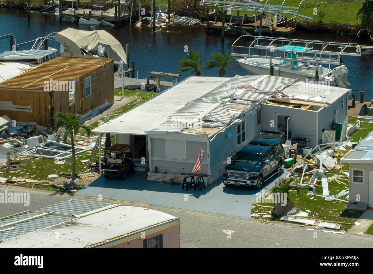 Wind damage of private houses after hurricane swept through Florida ...