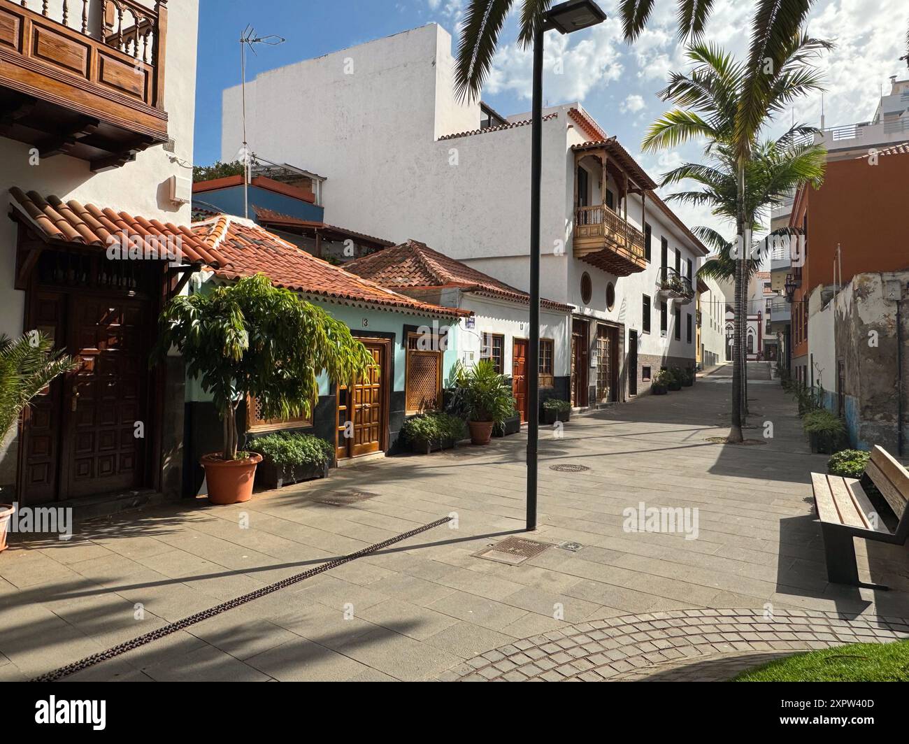 Picturesque Spanish Street with Traditional Architecture and Palm Trees ...