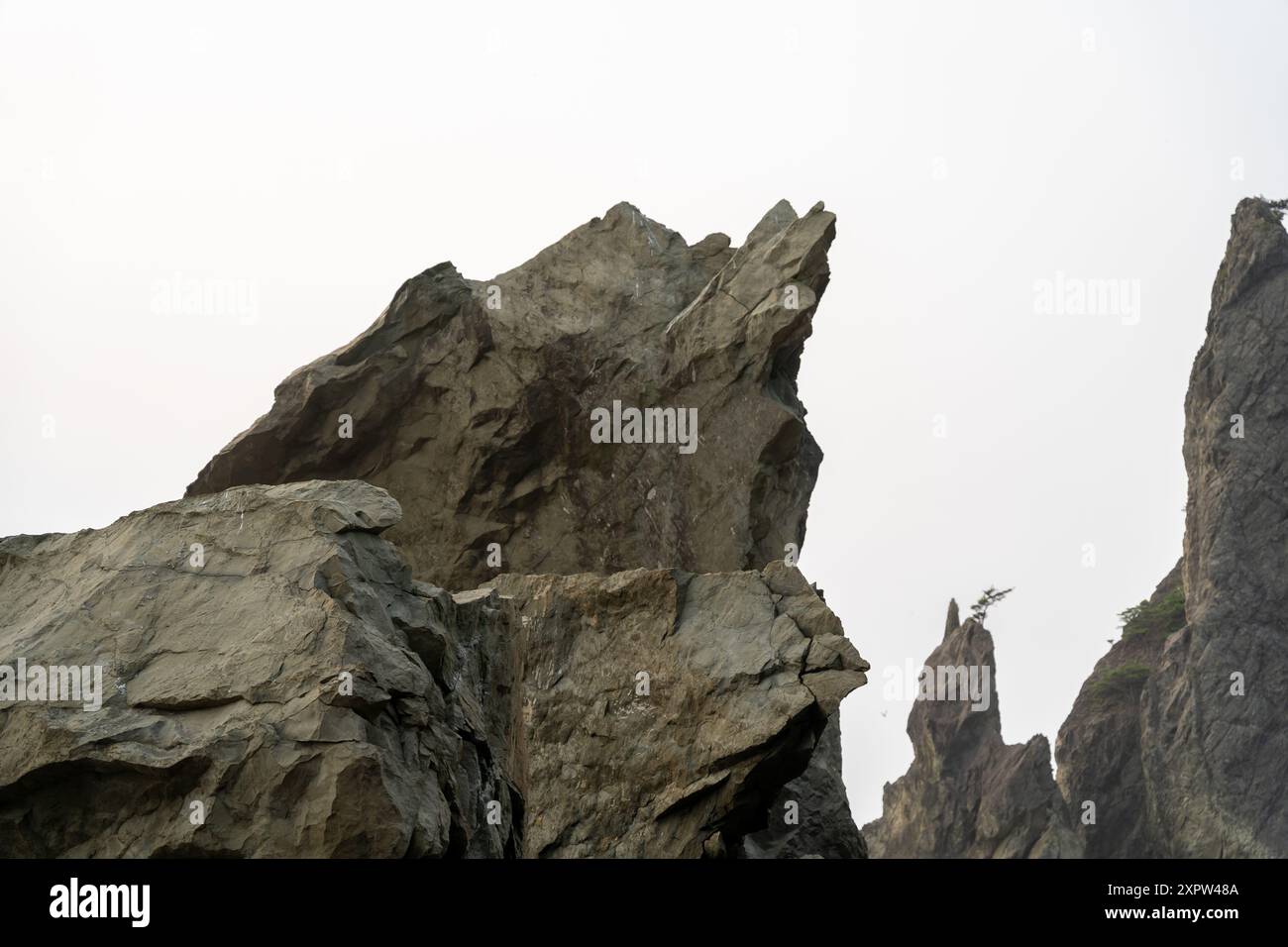 A beautiful view of giant rocks and ocean at Rialto Beach on a cloud ...