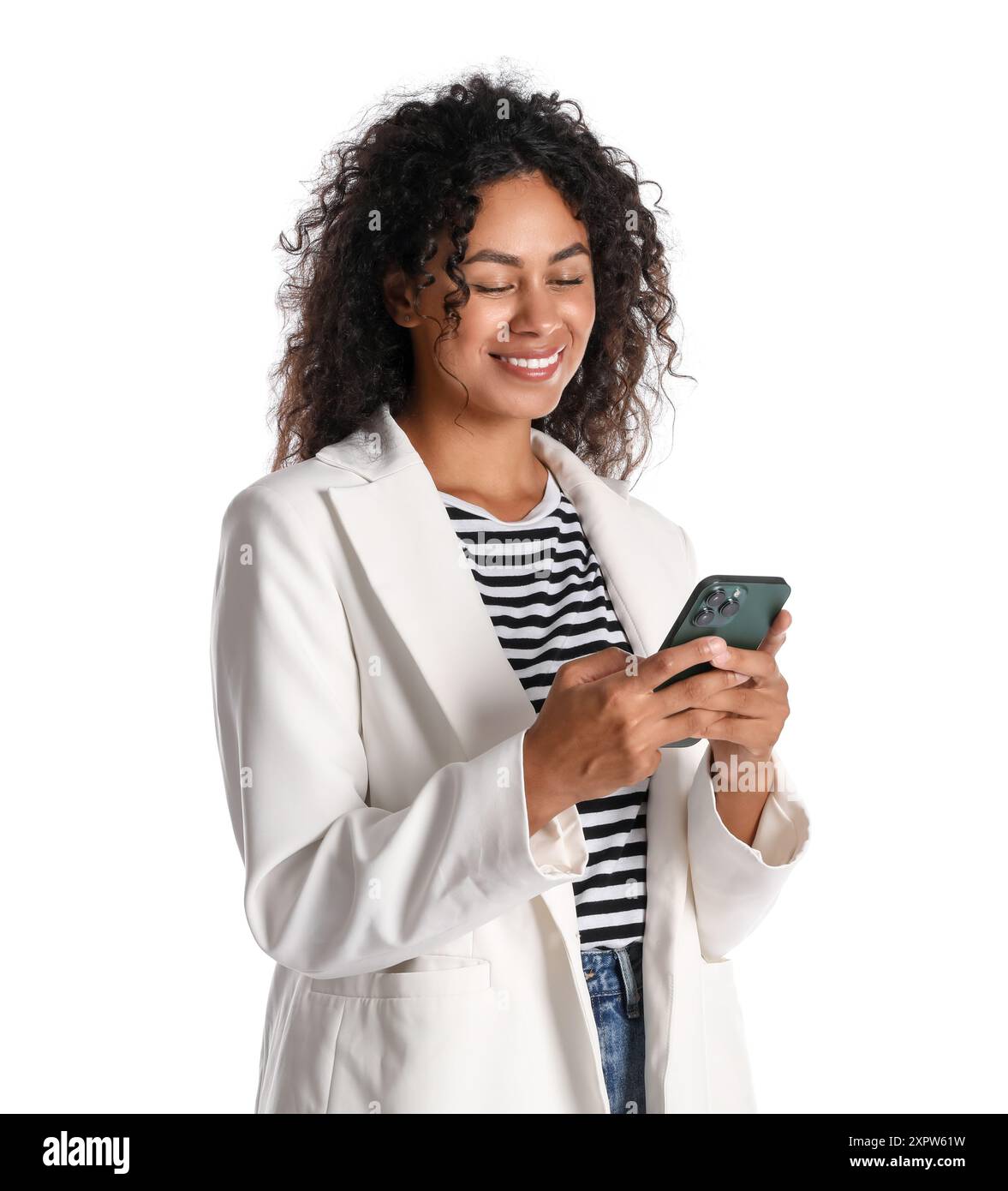 Beautiful woman in stylish jacket using smartphone on white background ...