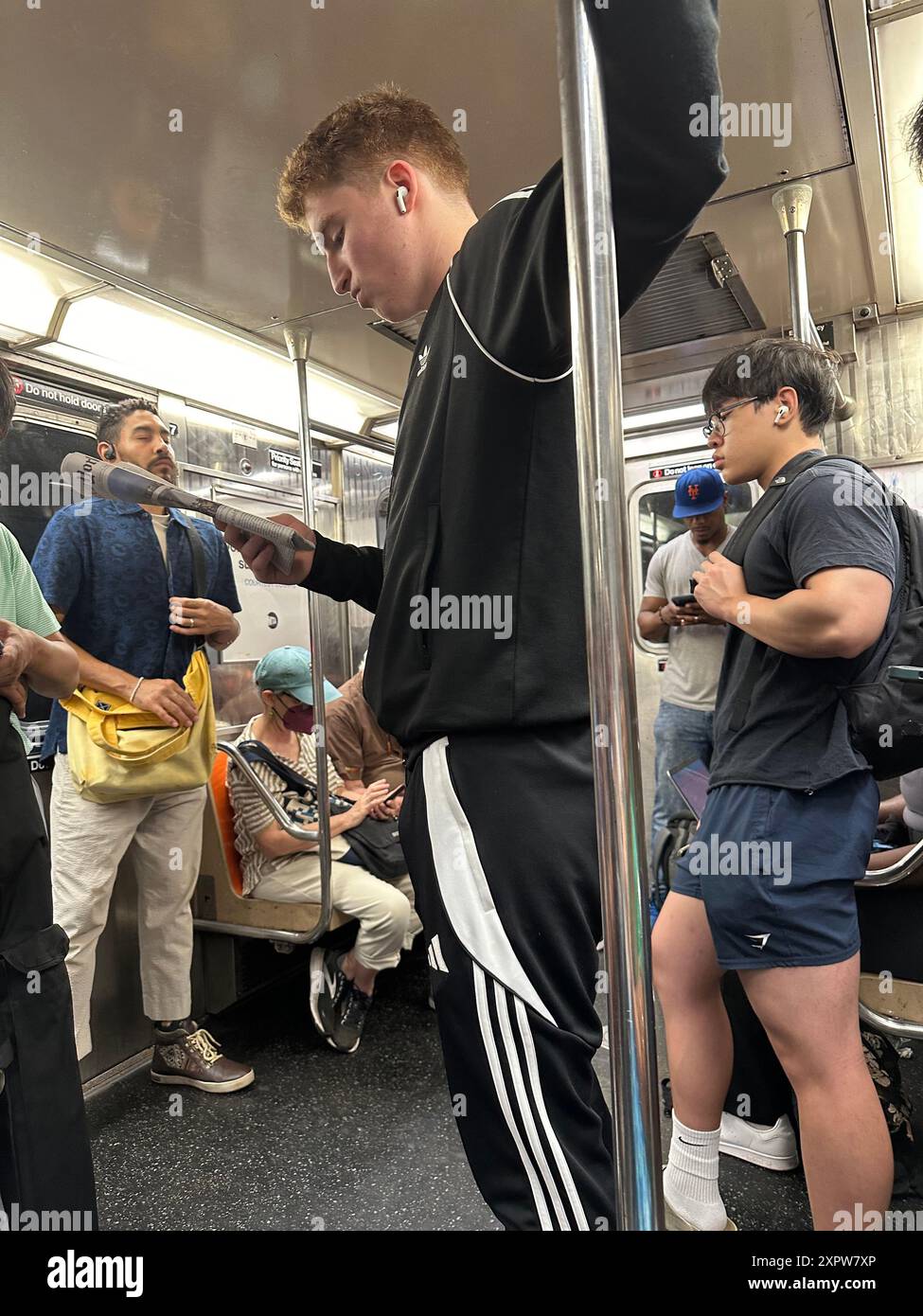 New York subway riders commuting on weekday Stock Photo - Alamy