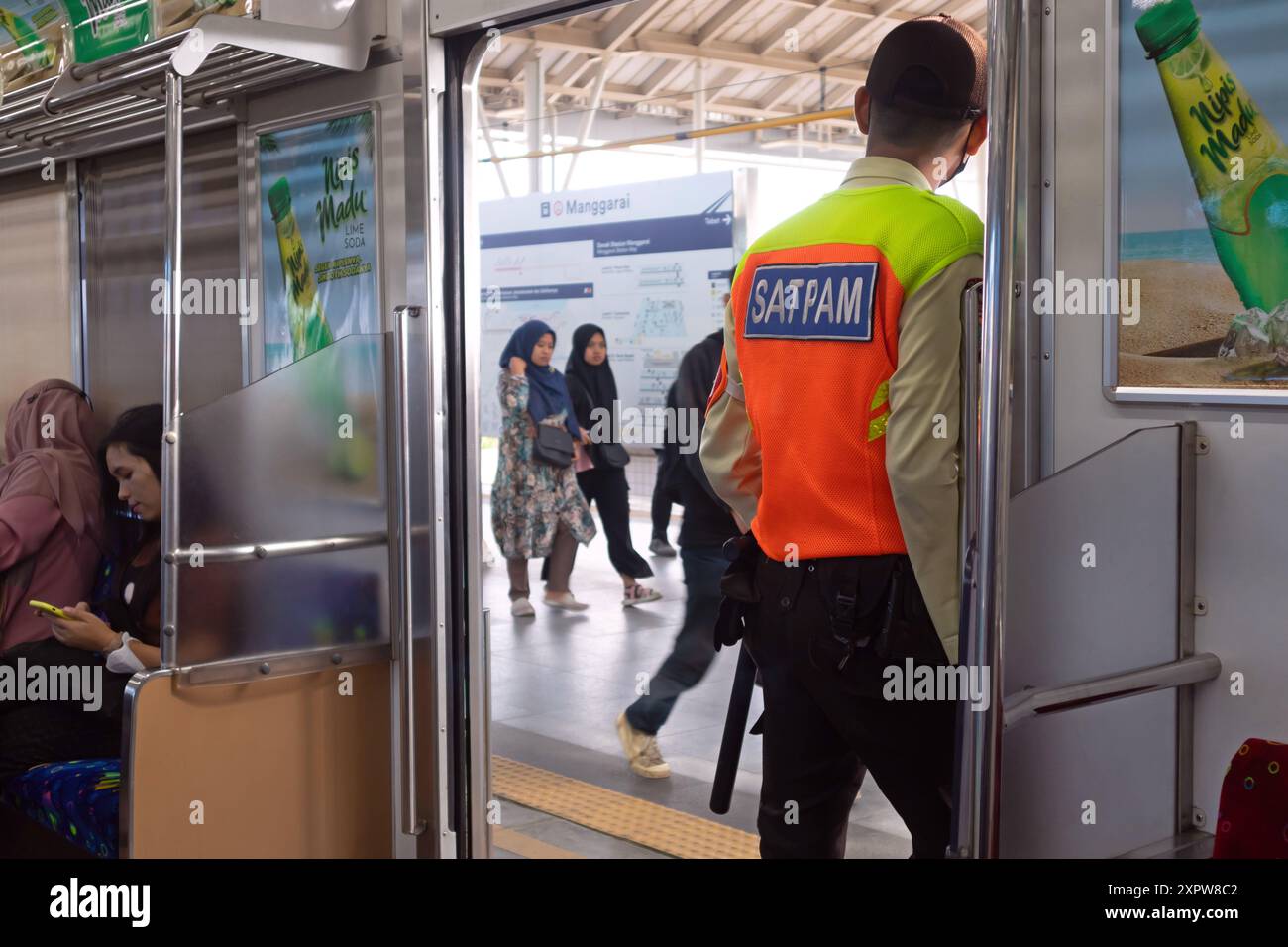 Jakarta, Indonesia - February 08, 2024: Commuter line security officer ...