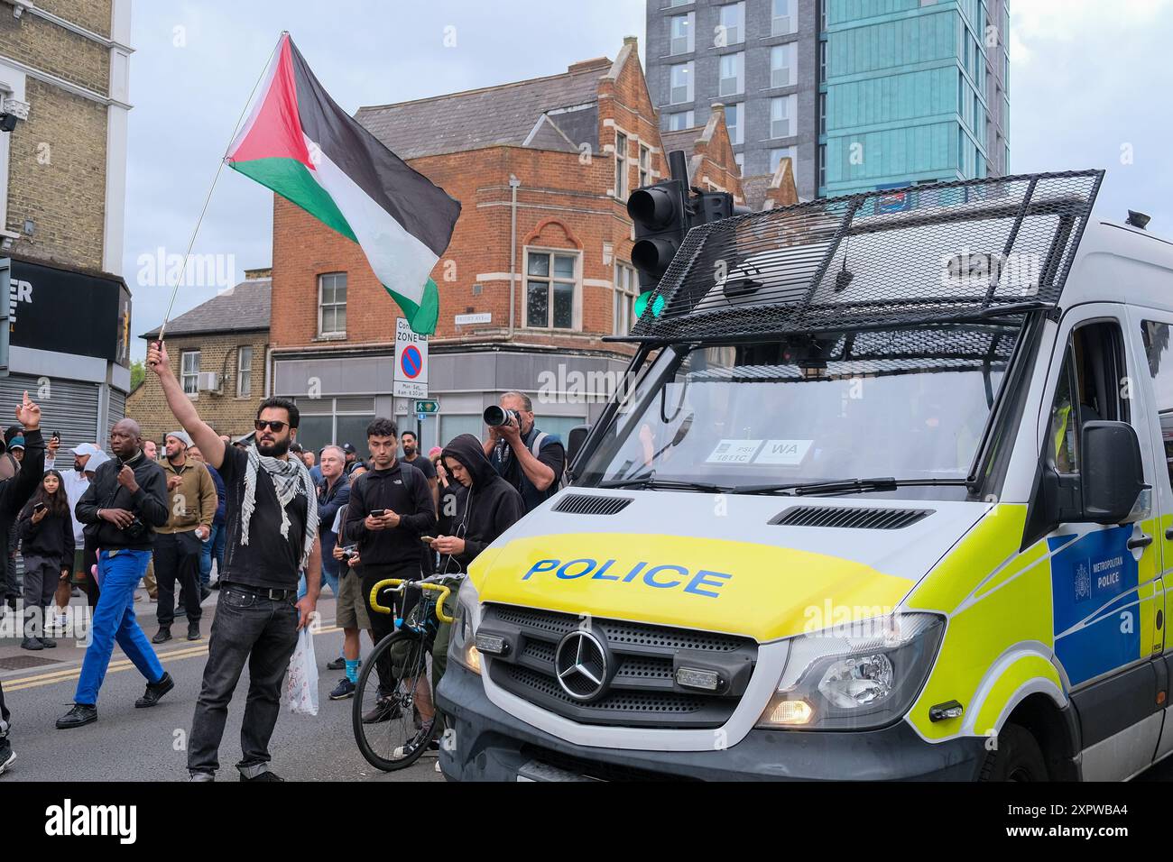 London, UK, 7th August, 2024. Locals gather close to Walthamstow ...