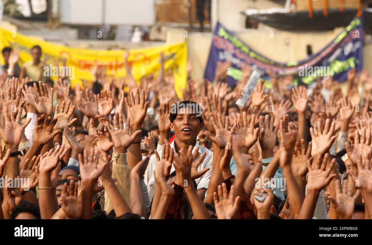 FILE- A supporter of Awami League leader Sheikh Hasina tries to look at ...