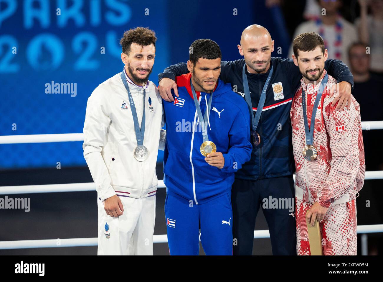 Paris, France. 07th Aug, 2024. Silver medallist France's Sofiane Oumiha, gold medallist Cuba's ...