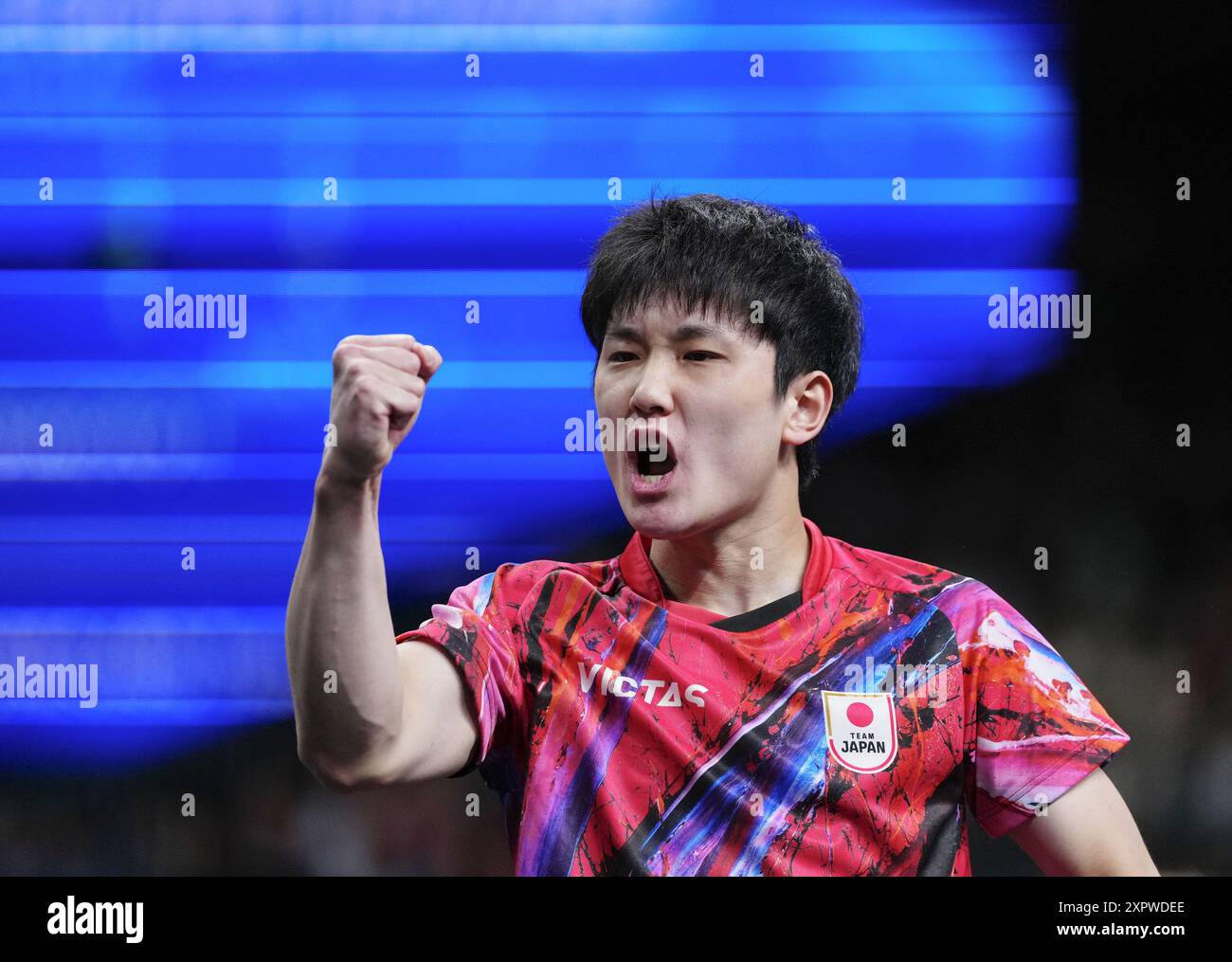 Japan's Tomokazu Harimoto reacts after winning the first game against ...