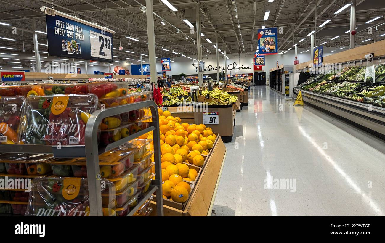 Fresh vegetables and fruits on the counter in a superstore Stock Photo ...