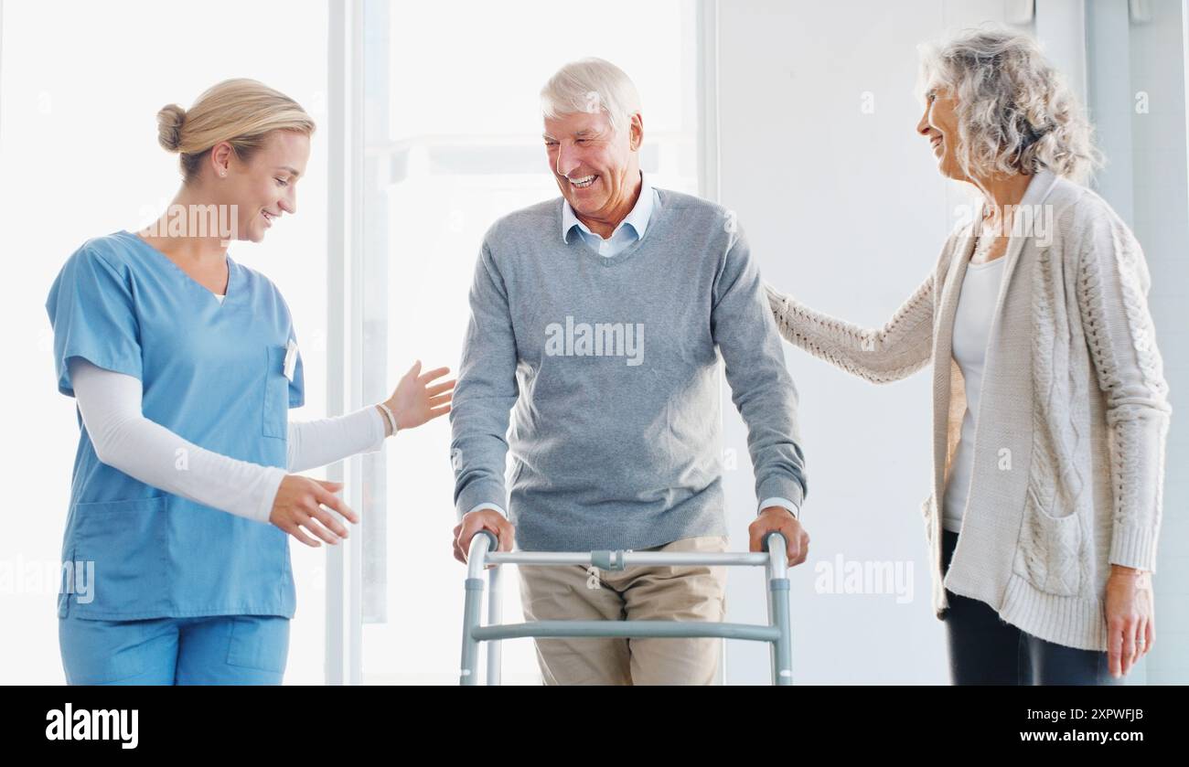 Caregiver, walking and old man with walker, smile and senior couple ...