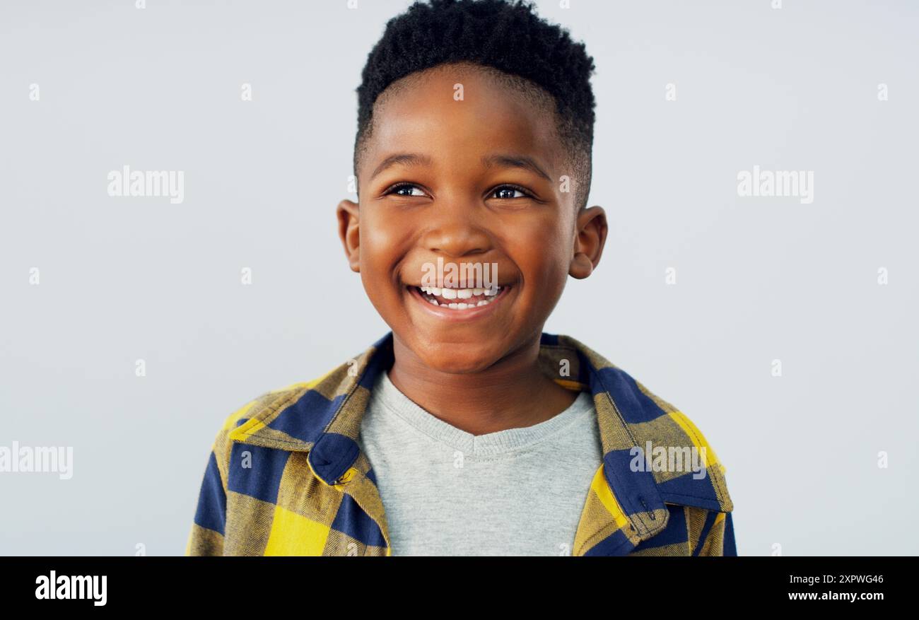 Thinking, smile and black child in studio for fashion, excited and ...