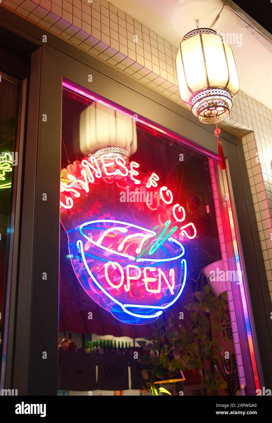Vertical neon sign "Chinese food OPEN" on the restaurant window Stock ...