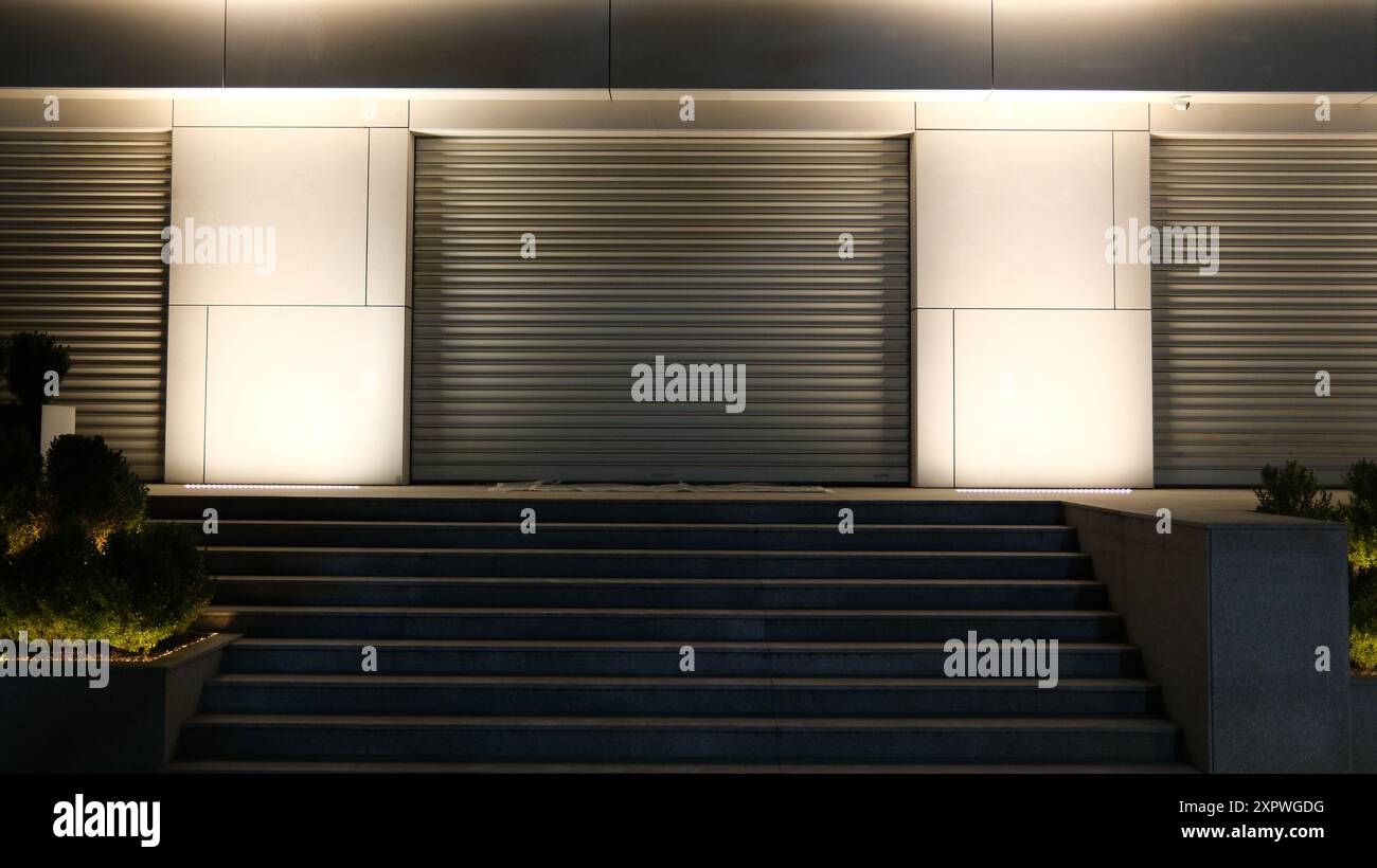 A wide retail store window closed for the night Stock Photo - Alamy