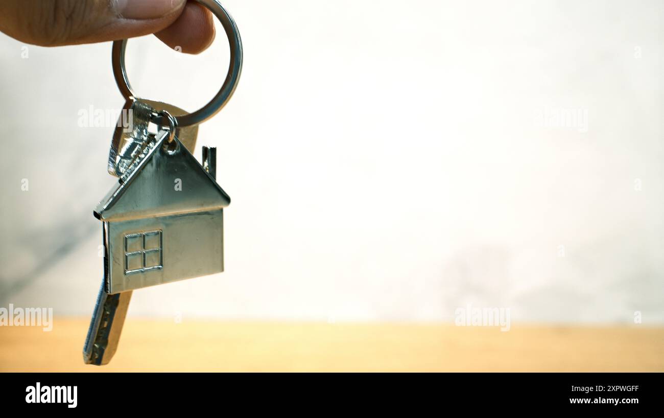 House key keychain in hand hi-res stock photography and images - Alamy