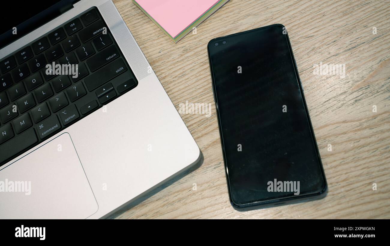 Office desktop with laptop, smartphone and sticky notes Stock Photo - Alamy