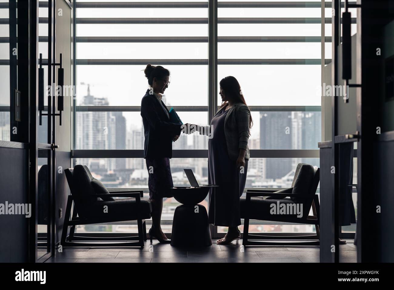 Diverse Asian business executives discussing Stock Photo - Alamy