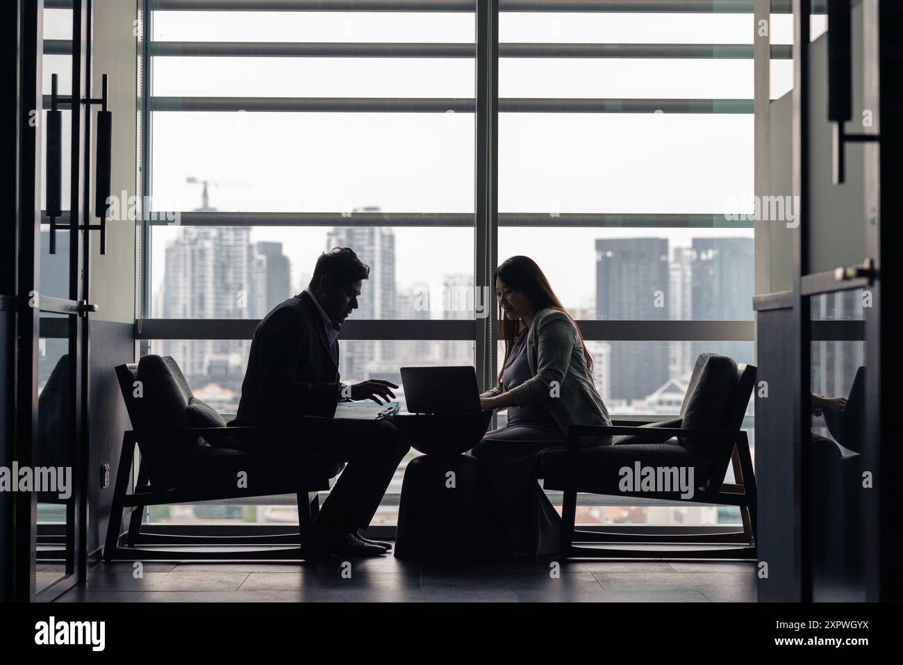 Diverse Asian business executives discussing Stock Photo - Alamy