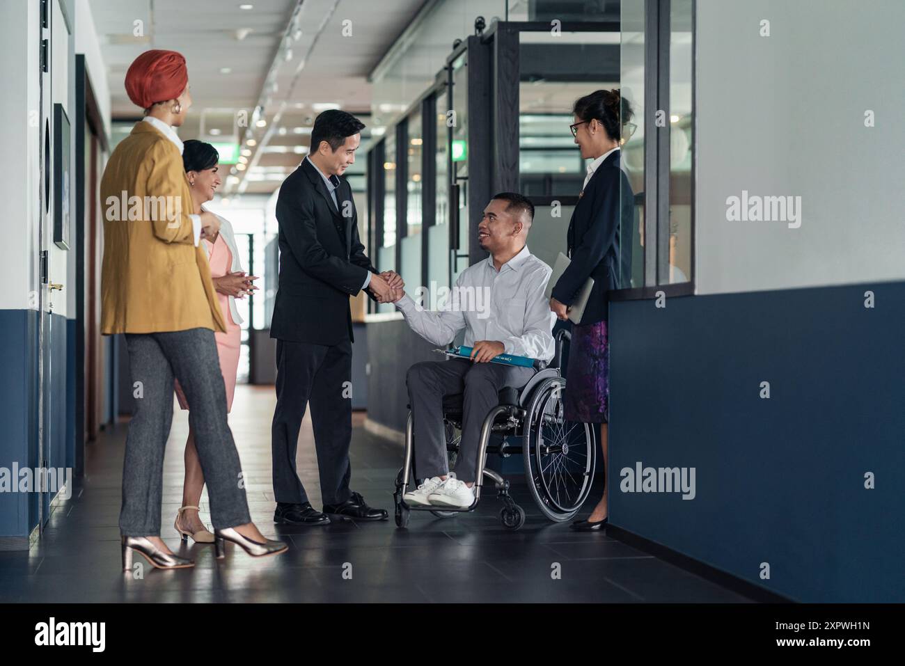 Diverse Asian team members in discussion Stock Photo - Alamy