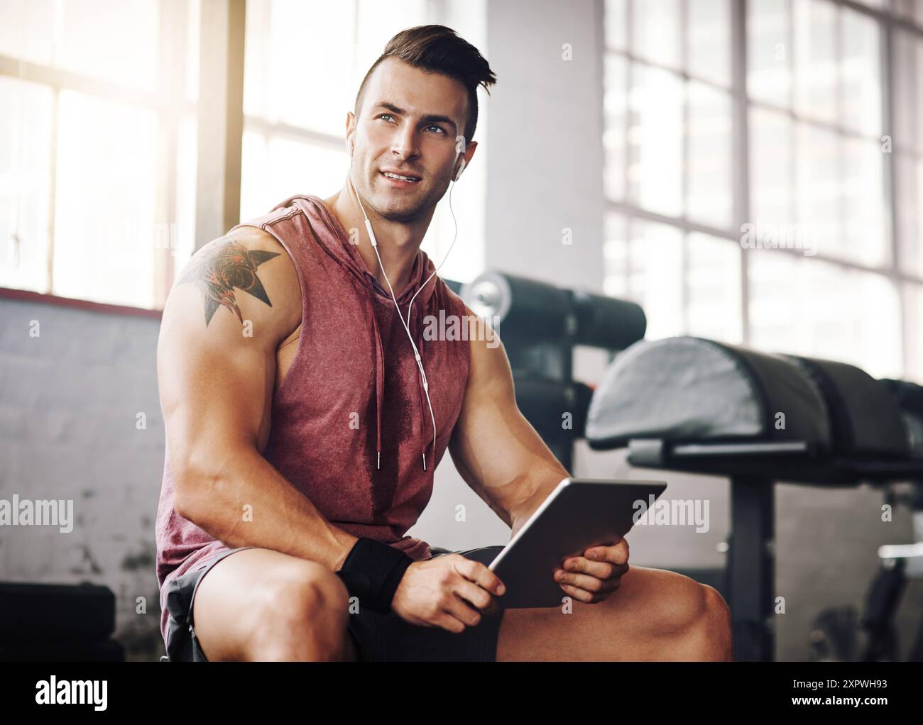 Exercise, man and tablet with music in gym for workout tracker ...