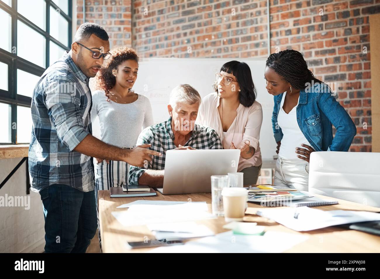 Reading, teamwork and group in meeting with laptop, creative and ...