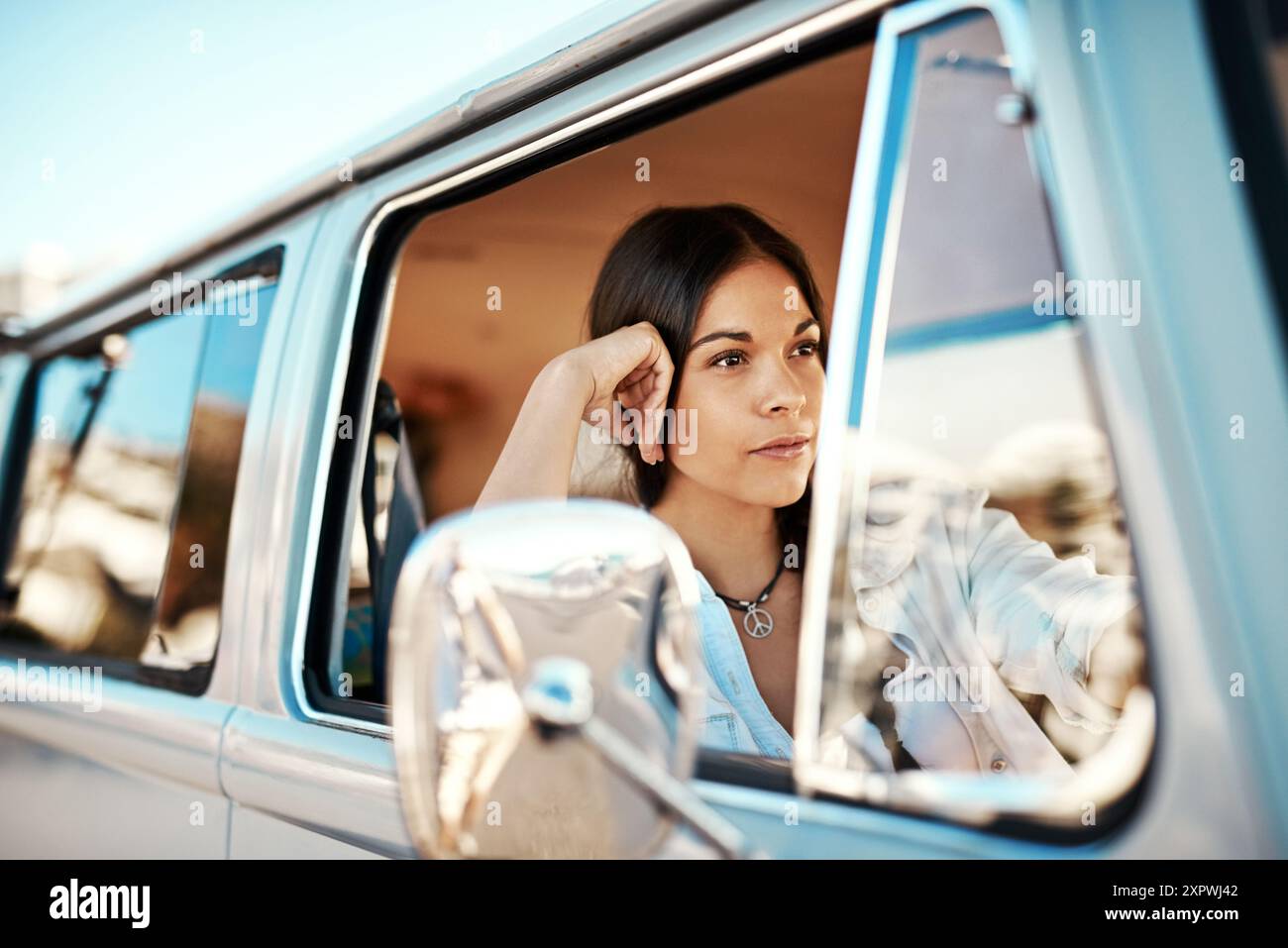 Thinking, woman and driver in minivan window for drive, travel and road ...