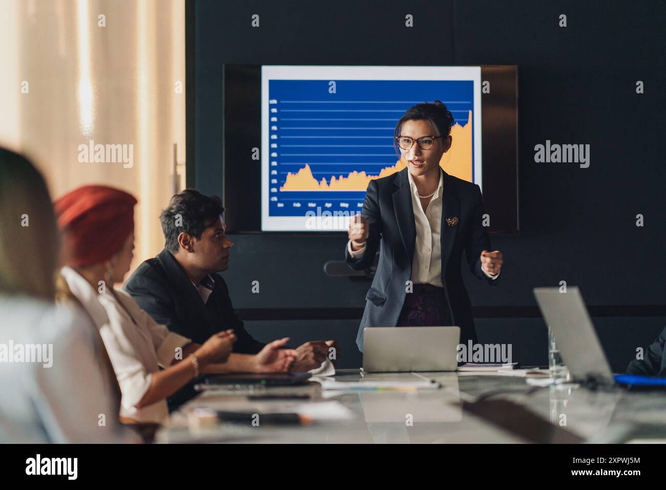 Diverse Asian business executives in a meeting Stock Photo - Alamy