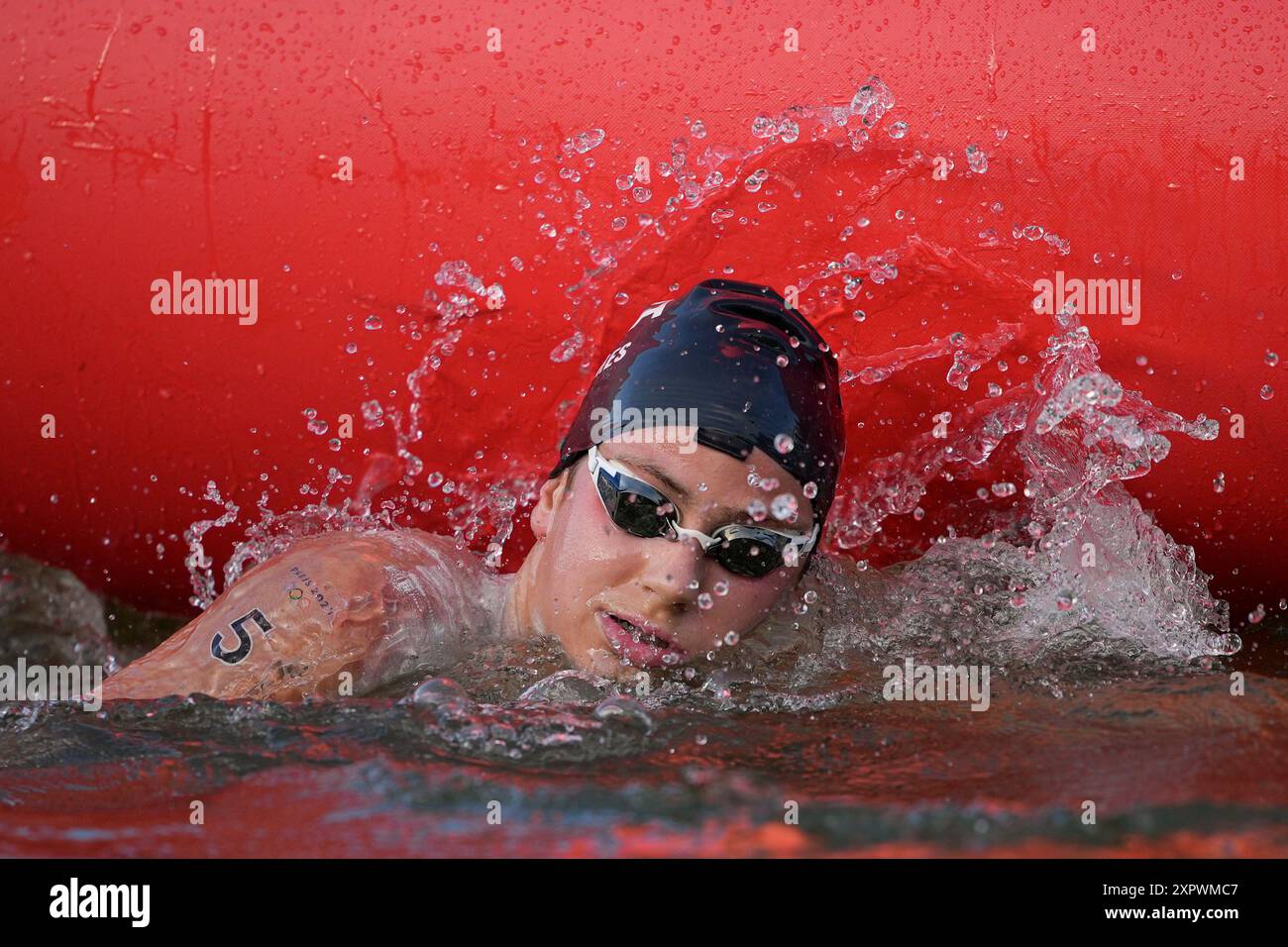 Katie Grimes, of the United States, competes during the marathon ...