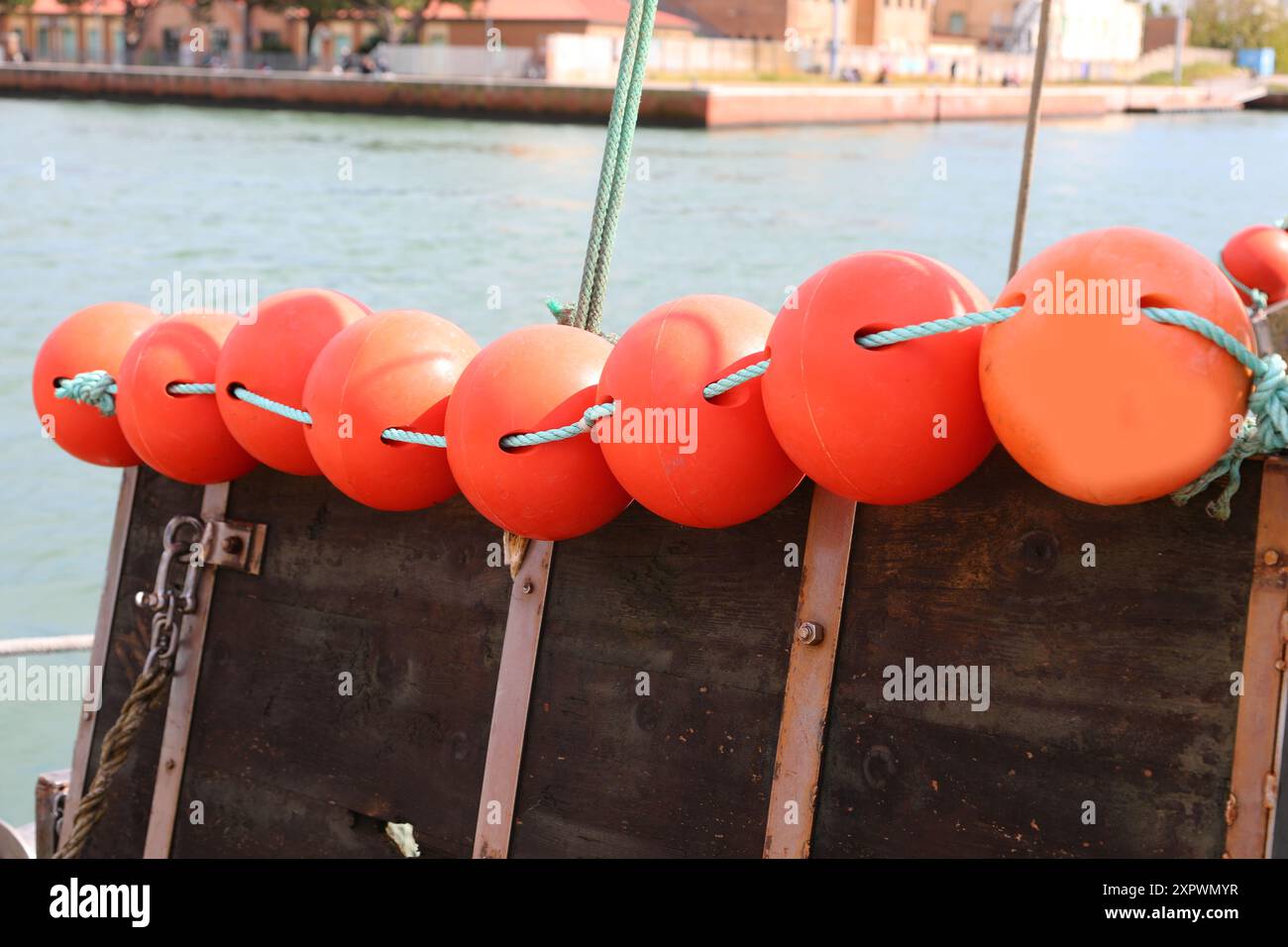 detail of the orange floating spheres tied together used by fishermen ...