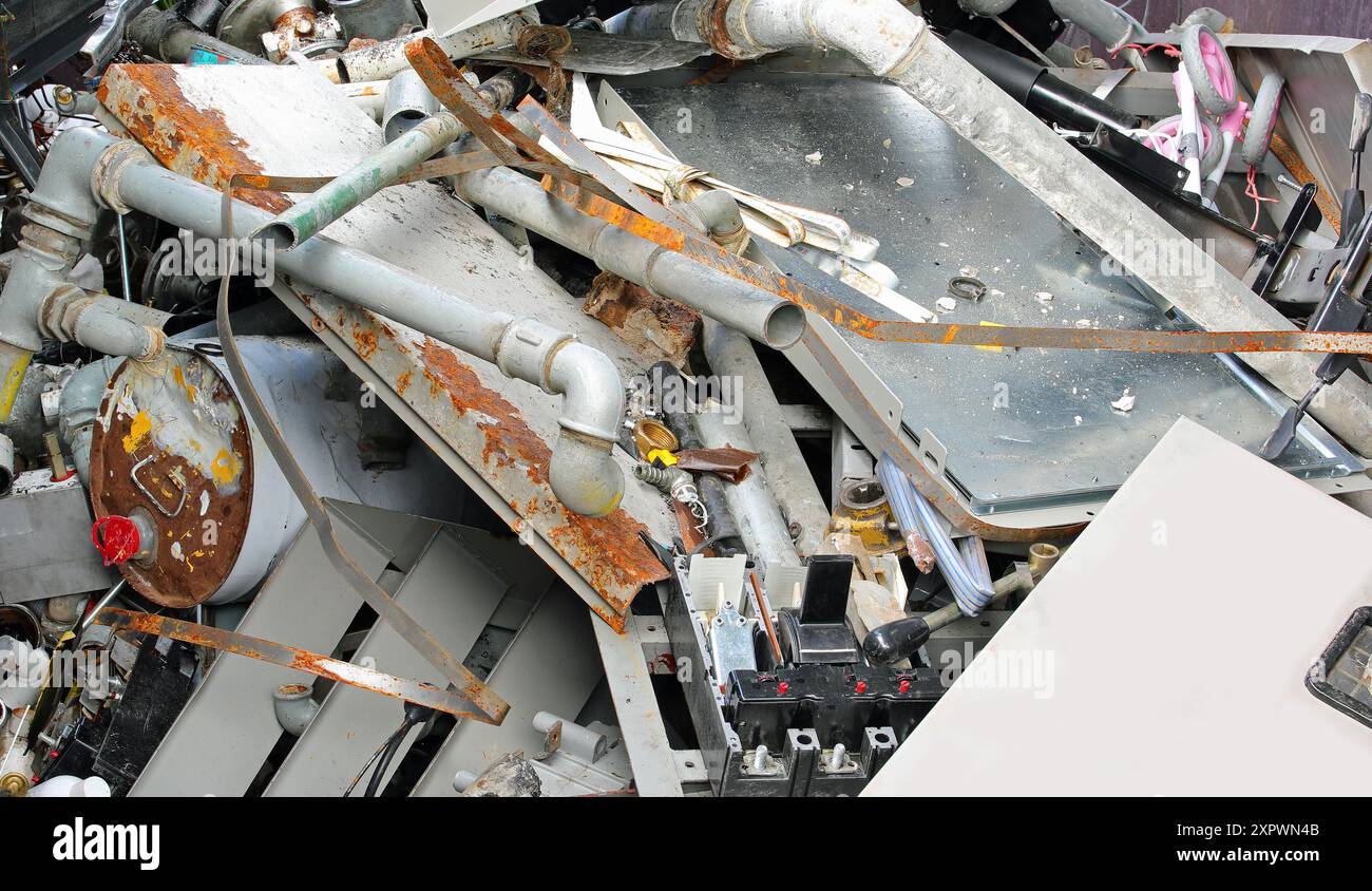 Scrap metal and twisted sheets in a recycling center container to ...