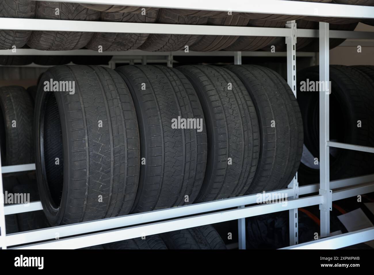 Group of car tires in auto store Stock Photo - Alamy