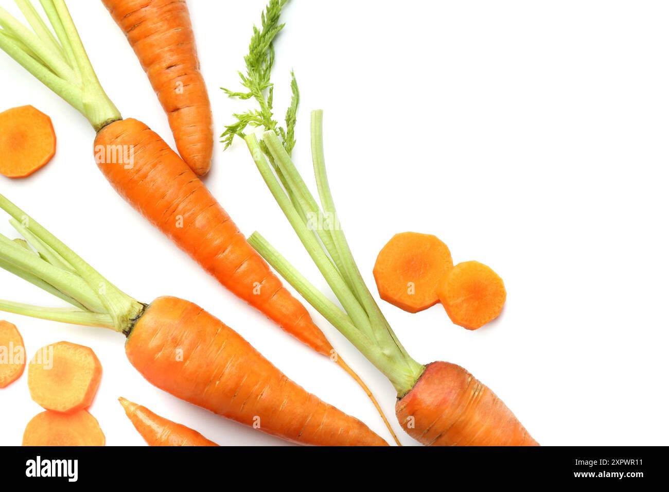 Whole and cut fresh carrots isolated on white, top view Stock Photo - Alamy
