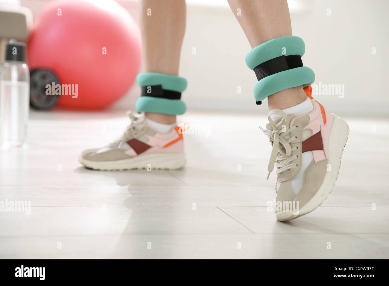 Woman ankle weights in hi-res stock photography and images - Alamy