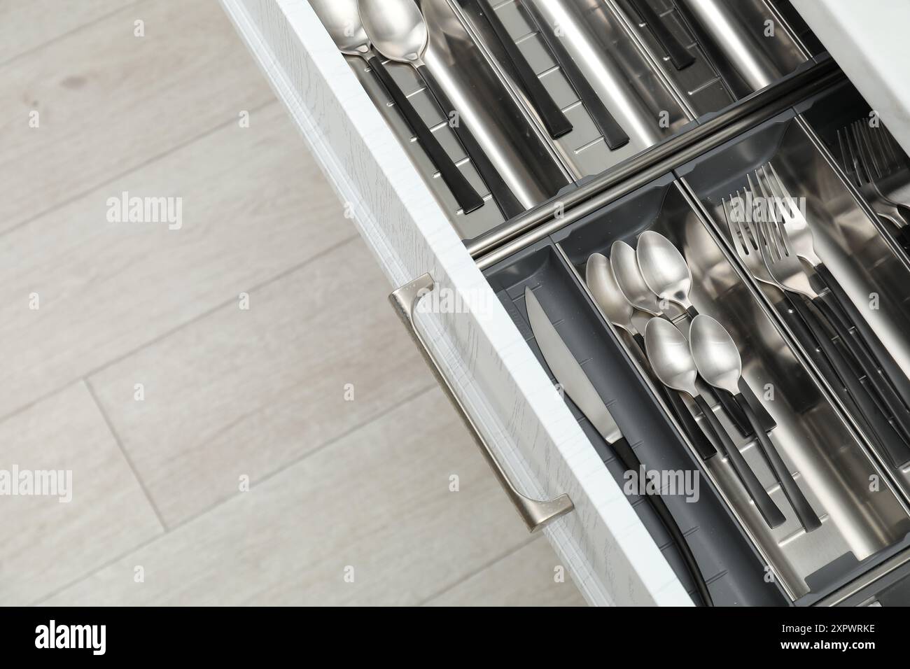 Box with cutlery in drawer, above view. Kitchen utensils storage Stock ...