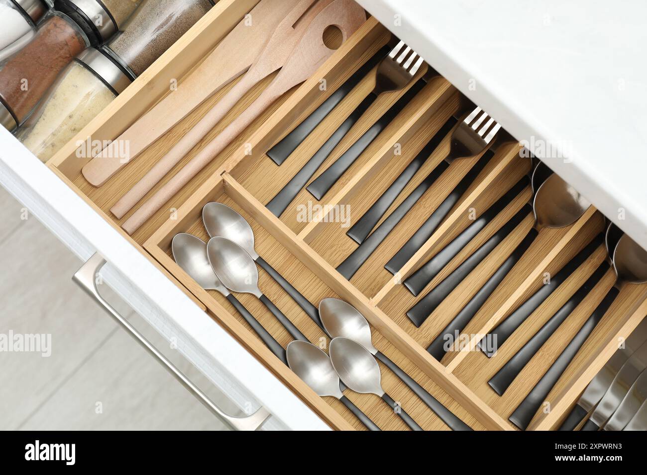 Box with cutlery in drawer, above view. Kitchen utensils storage Stock ...