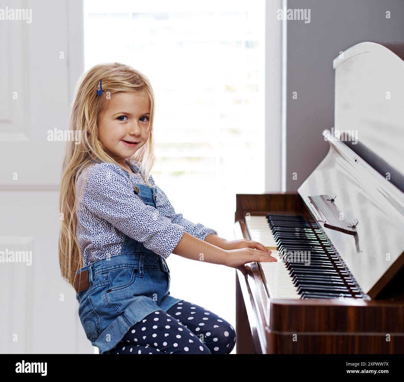 Girl, portrait and playing piano in home, learning musical instrument ...