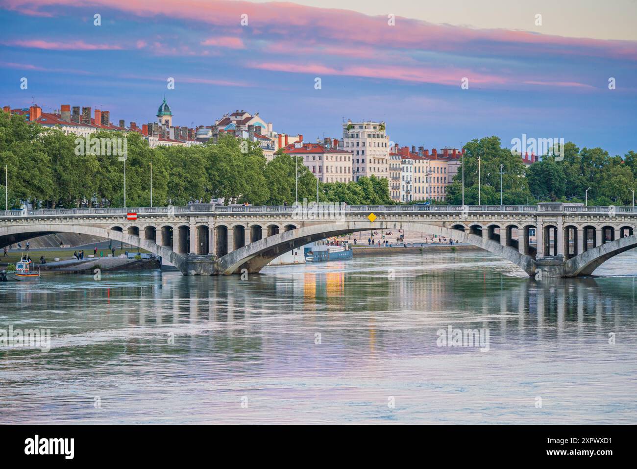 Awe view of a bridge over the River Rhone in Lyon, France, at dusk Stock Photo - Alamy