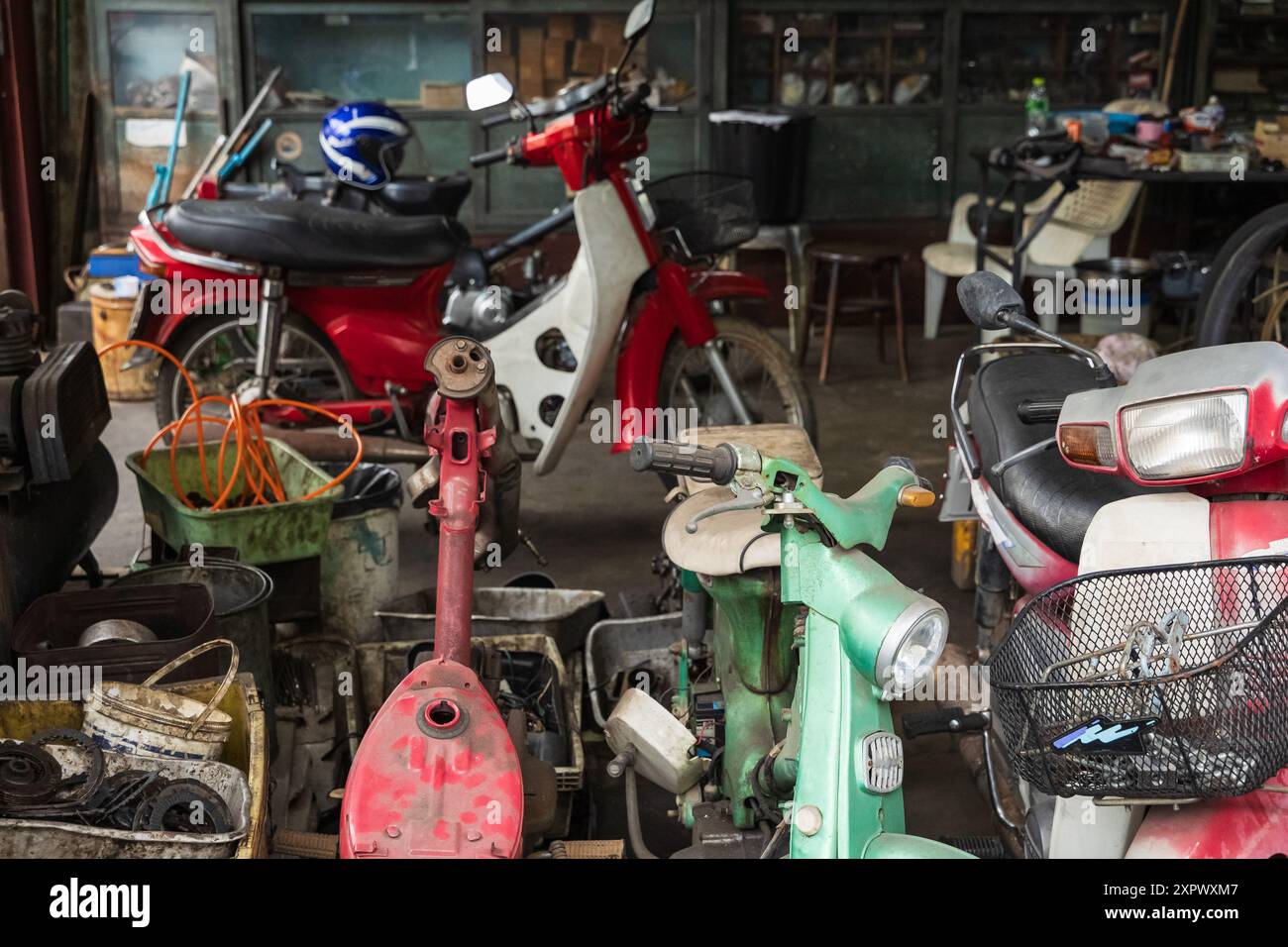 Motorcycle in the Repair shop. Old shop with broken bikes and scooters ...
