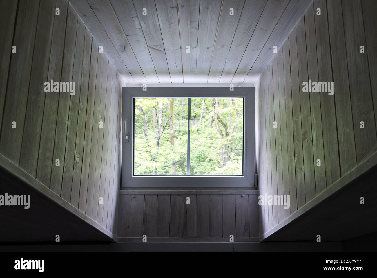 Attic window in empty wooden interior, front view Stock Photo - Alamy