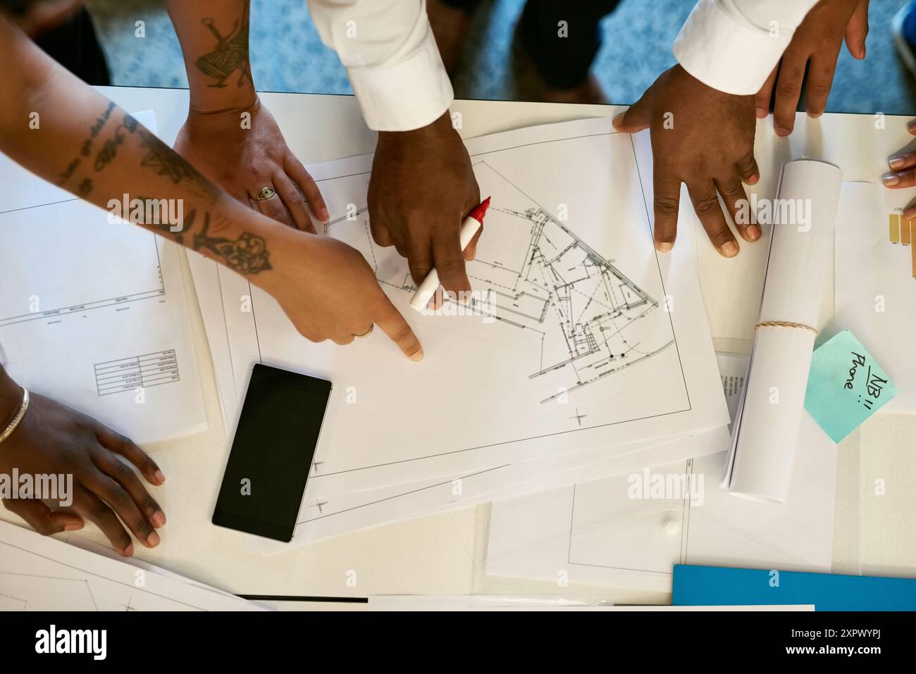 Hands, architecture design in workshop for blueprint, drawing and ...