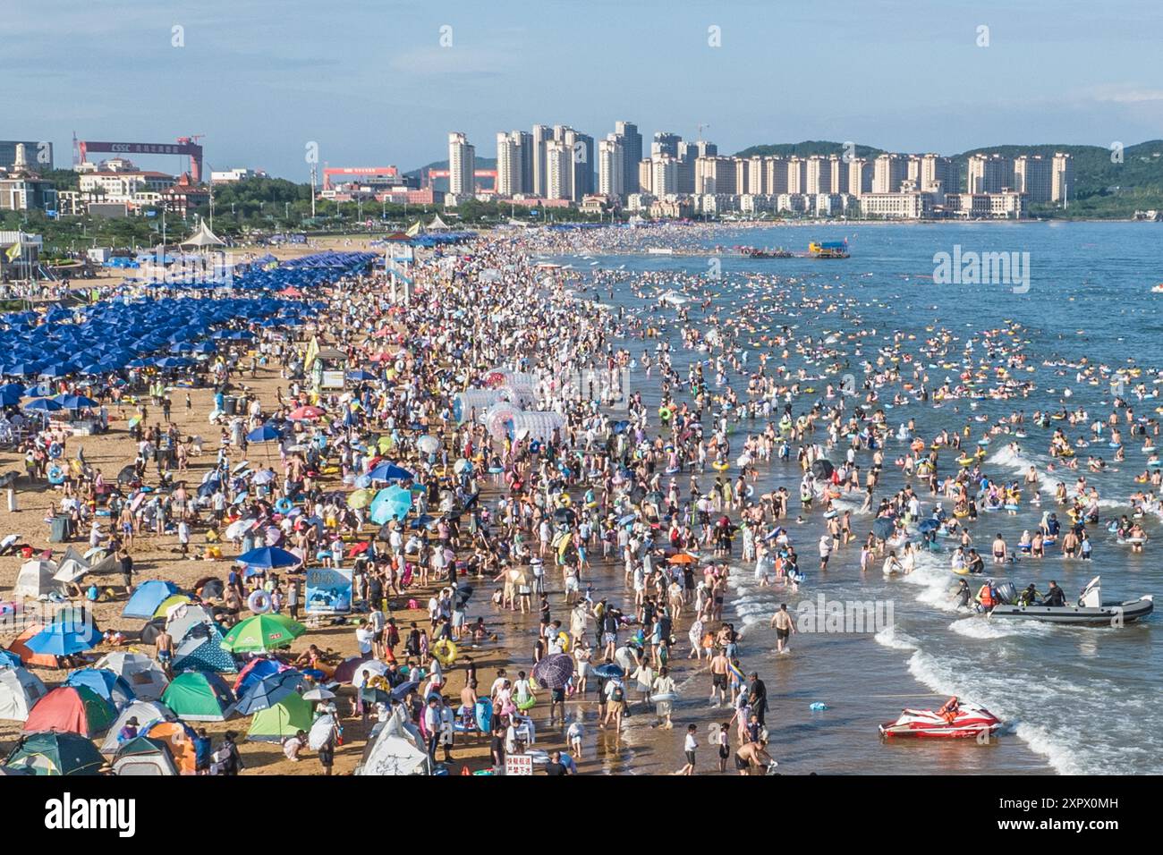 Aerial photo shows tourists enjoying the summer time on the beach in ...