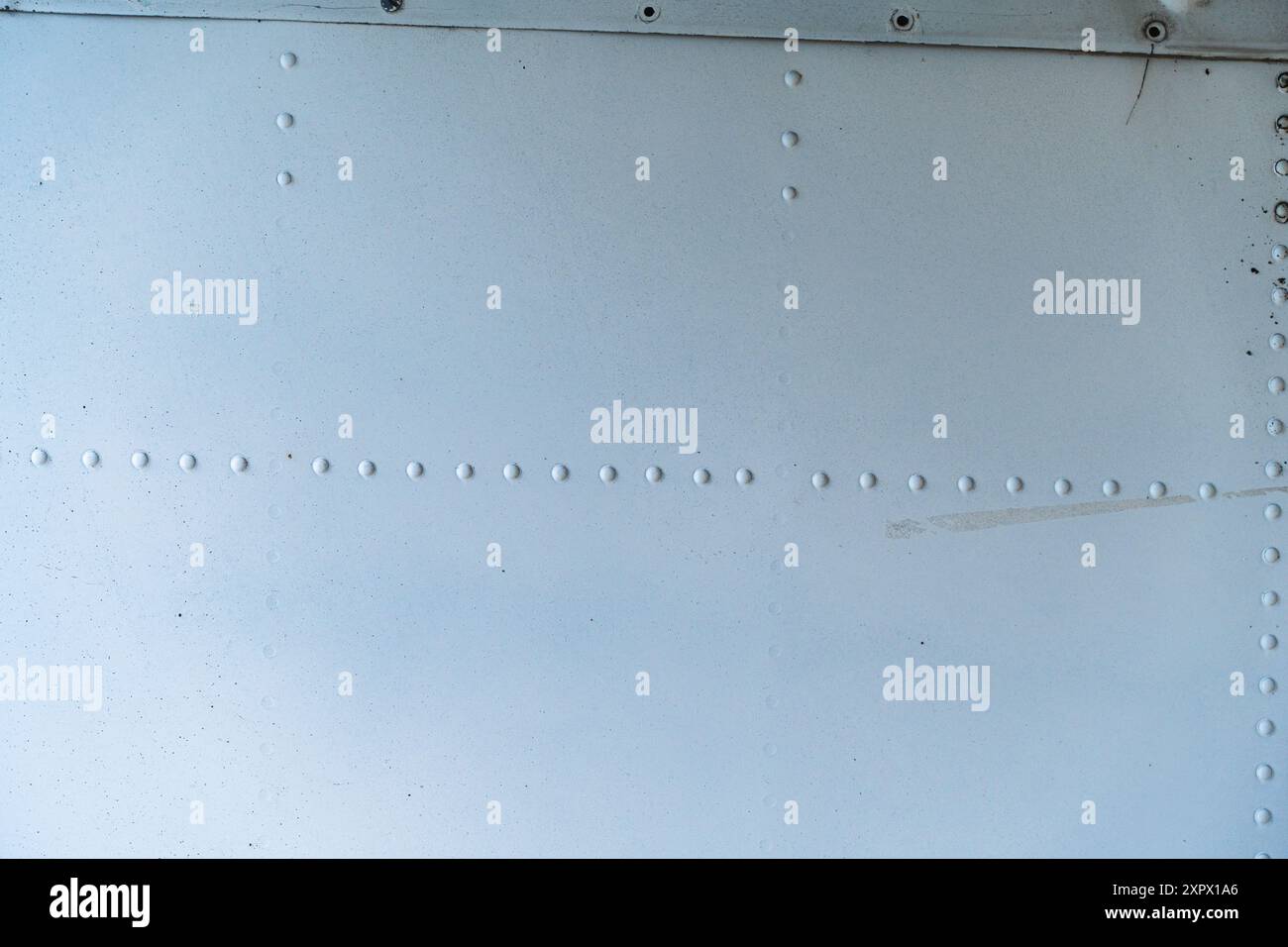 Background, texture of the metal skin of an aircraft in gray or steel ...