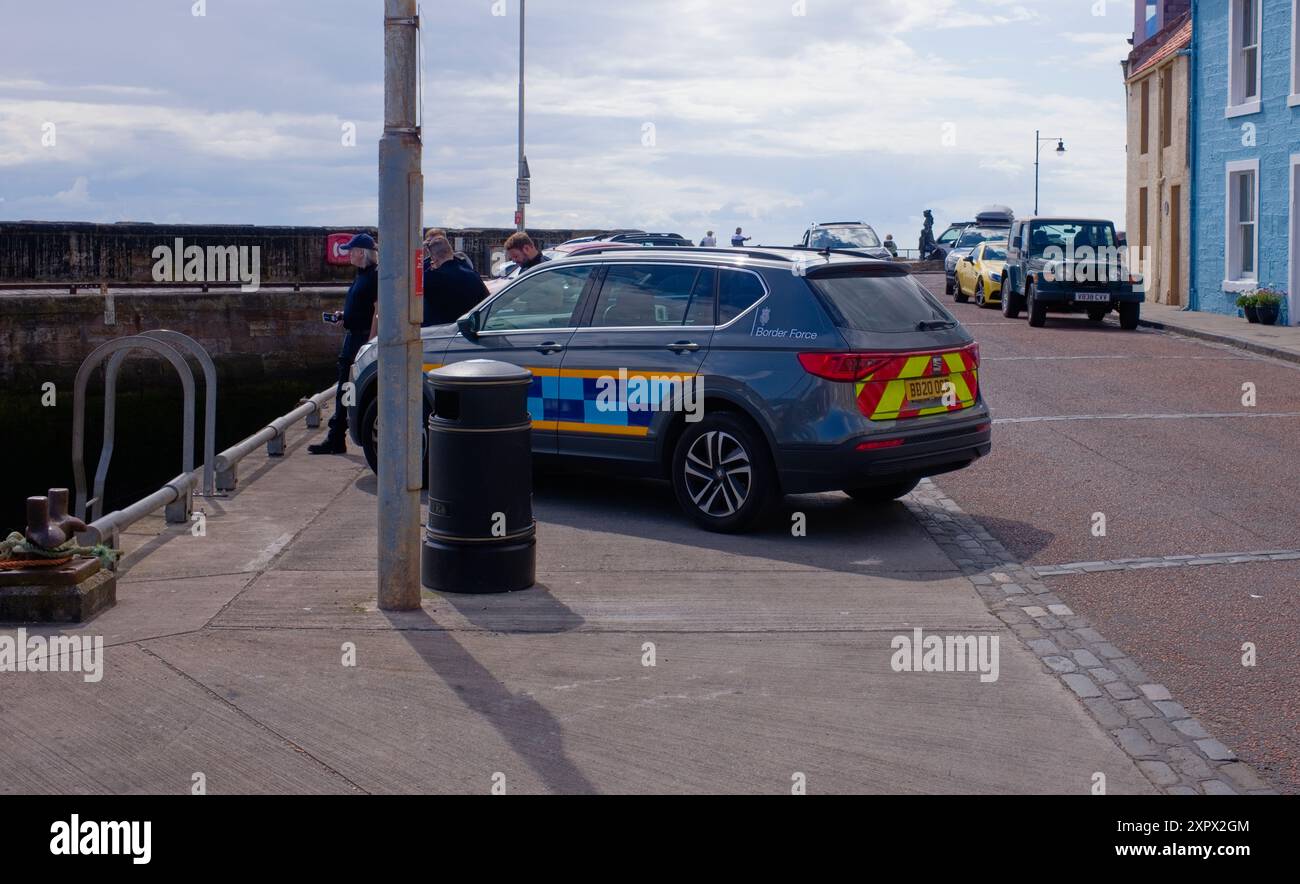 Border Force operatives on patrol in Pittenweem harbour, Fife, Scotland ...