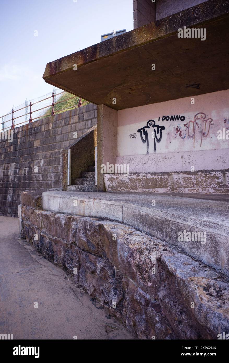 I donno, spelt wrong, lettering and graphic painted on sea wall in ...