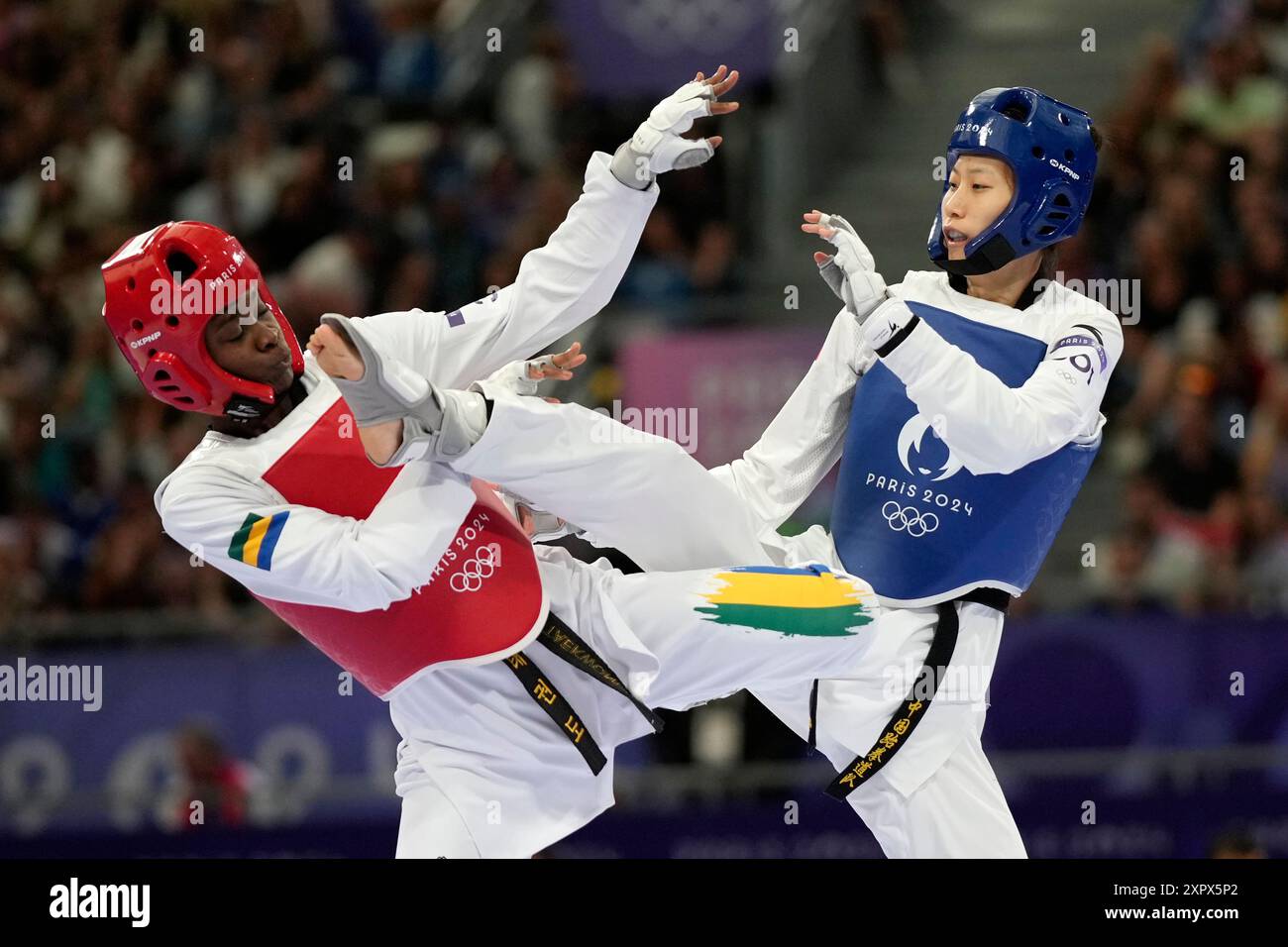 China's Luo Zongshi competes with Gabon's Emmanuella Atora in a women's ...
