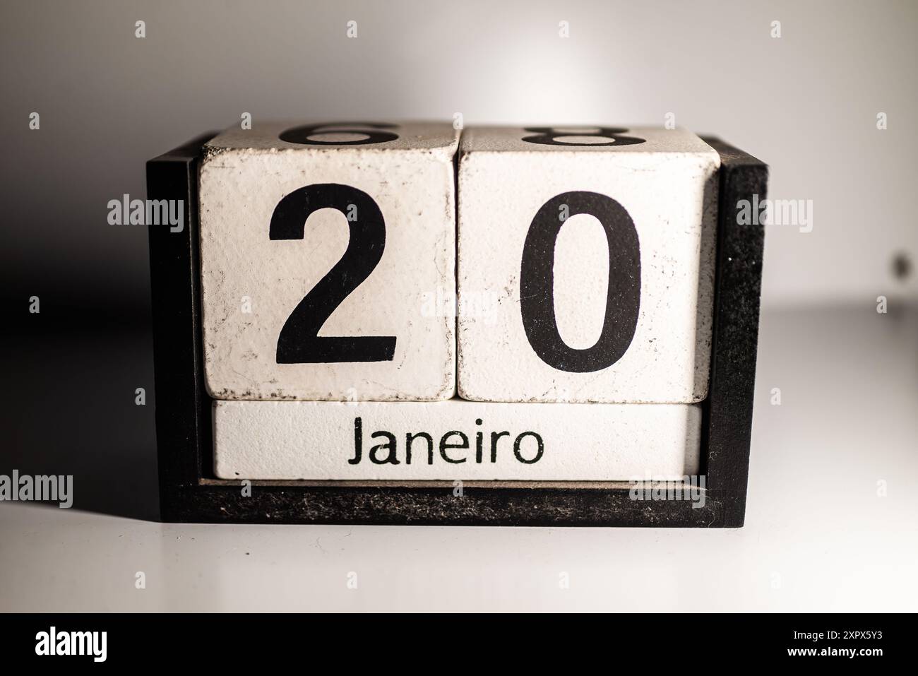 A Wooden perpetual calendar showing January 20th with a minimalistic ...