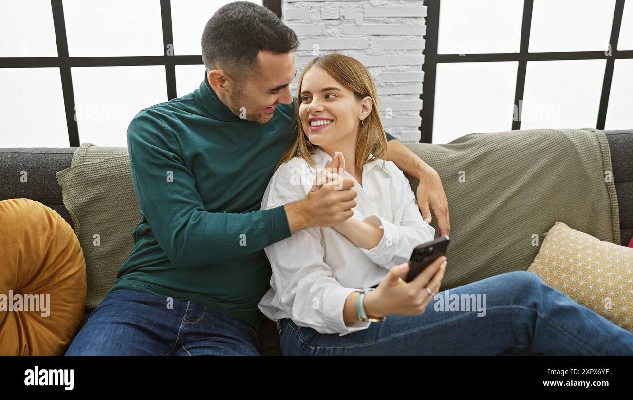 A loving couple enjoys a cozy moment together on a comfortable sofa in ...